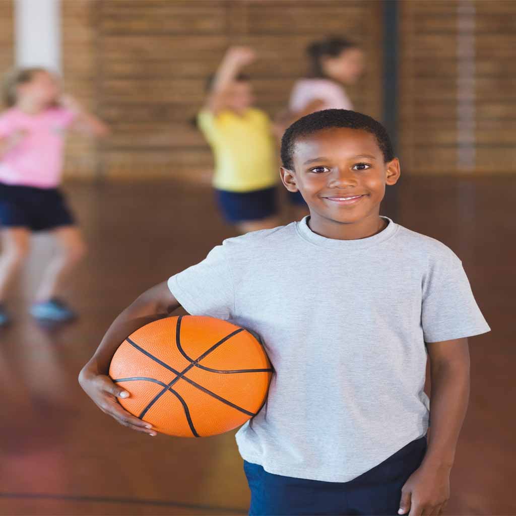 Little Boy Playing Basketball